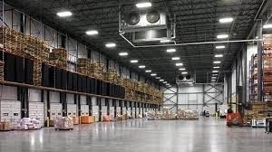 How are distribution centers different from warehouses?